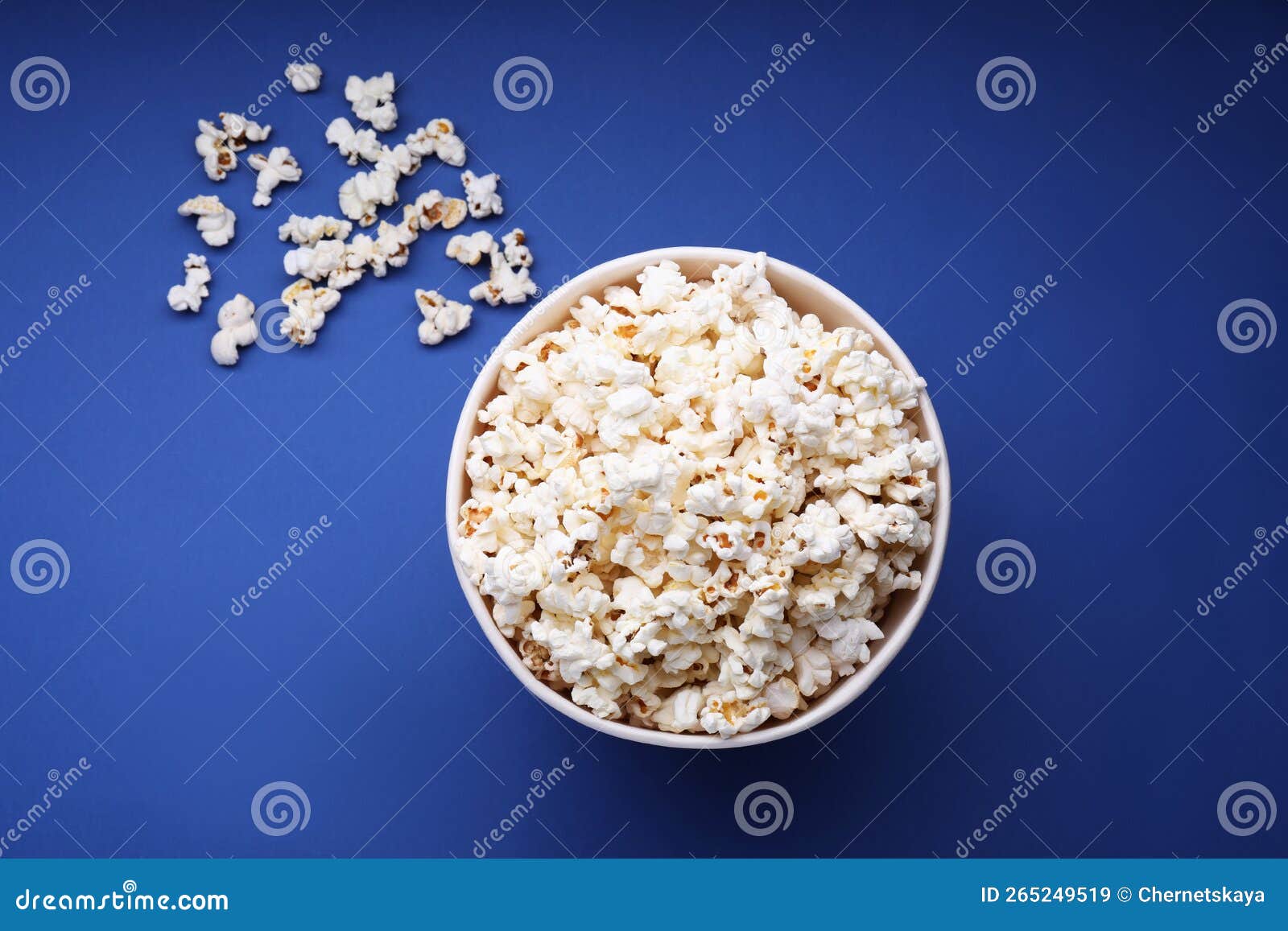 Bucket of Tasty Popcorn on Blue Background, Flat Lay Stock Image ...