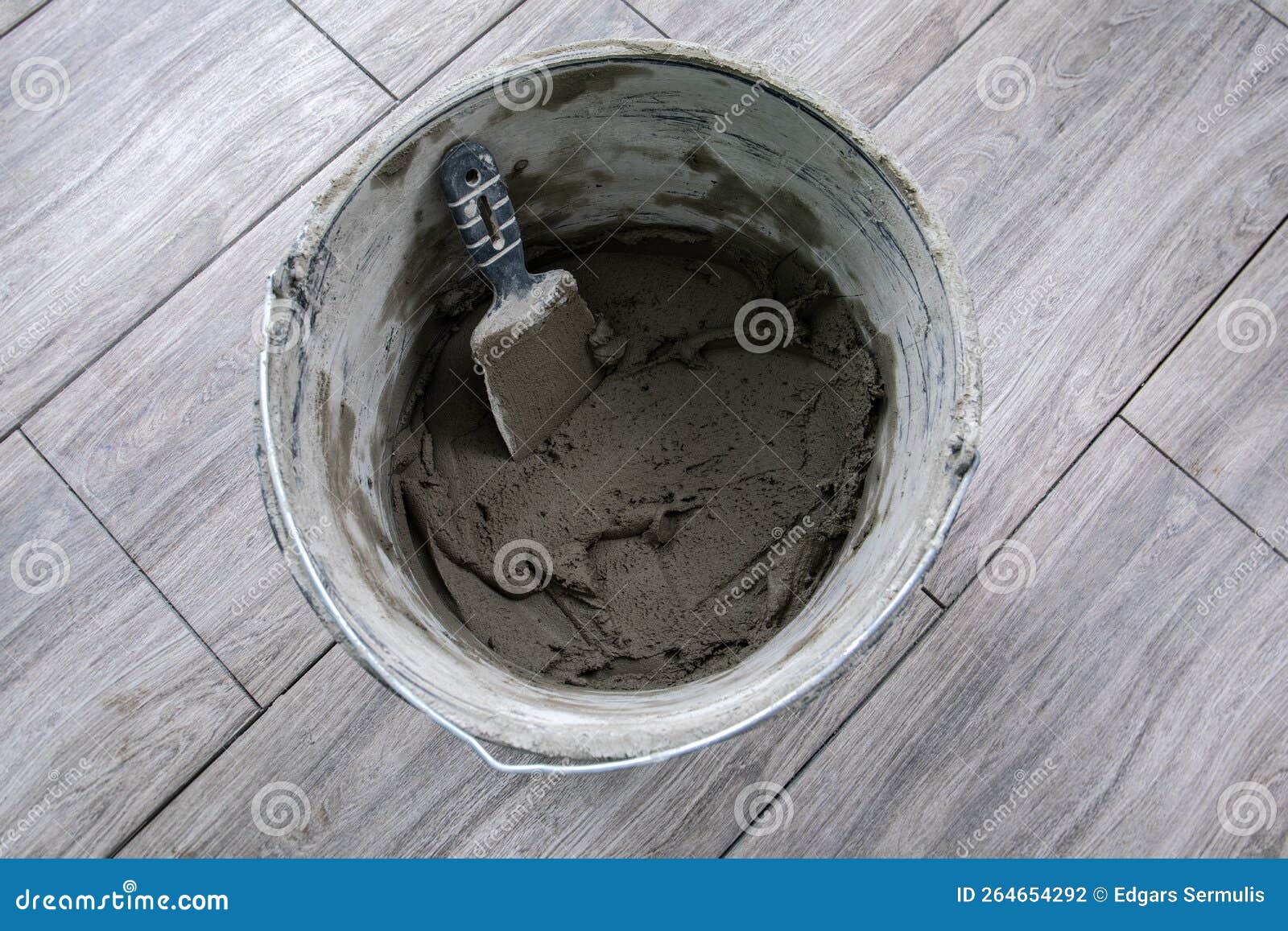 Bucket of Tile Adhesive and a Trowel. Repairs and Construction Stock ...