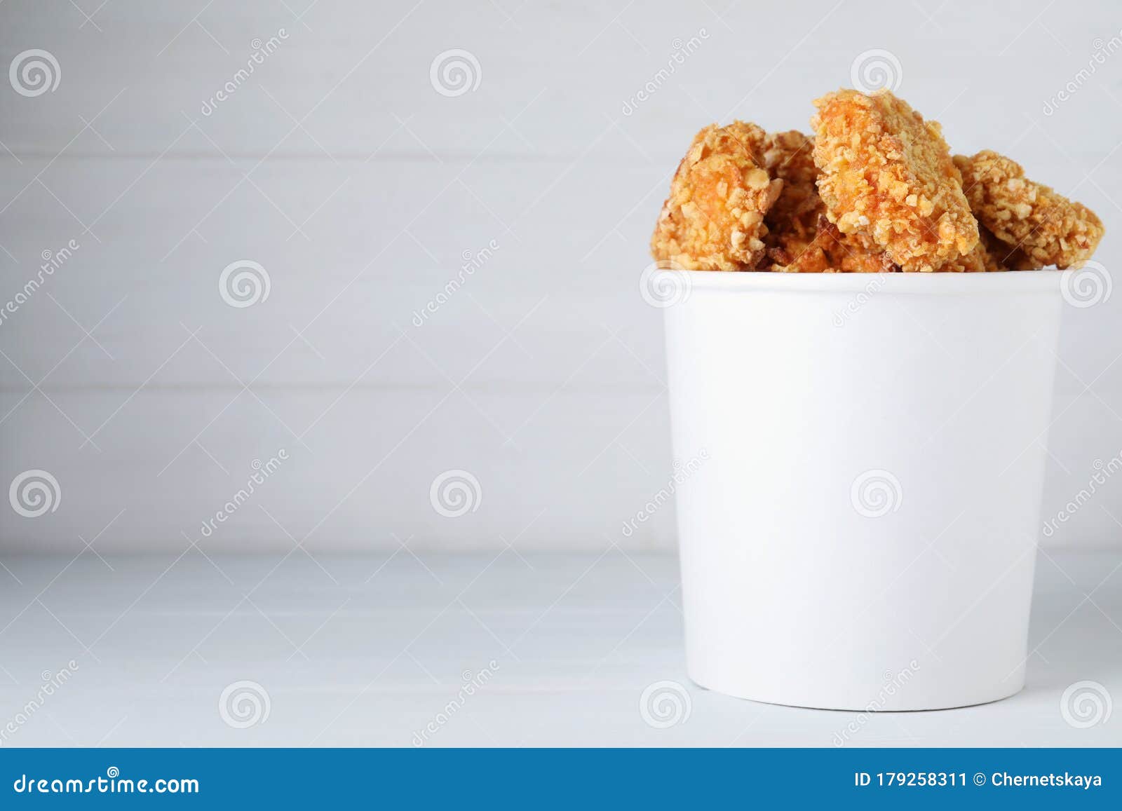 Bucket with Yummy Nuggets on Table, Space for Text Stock Image - Image ...