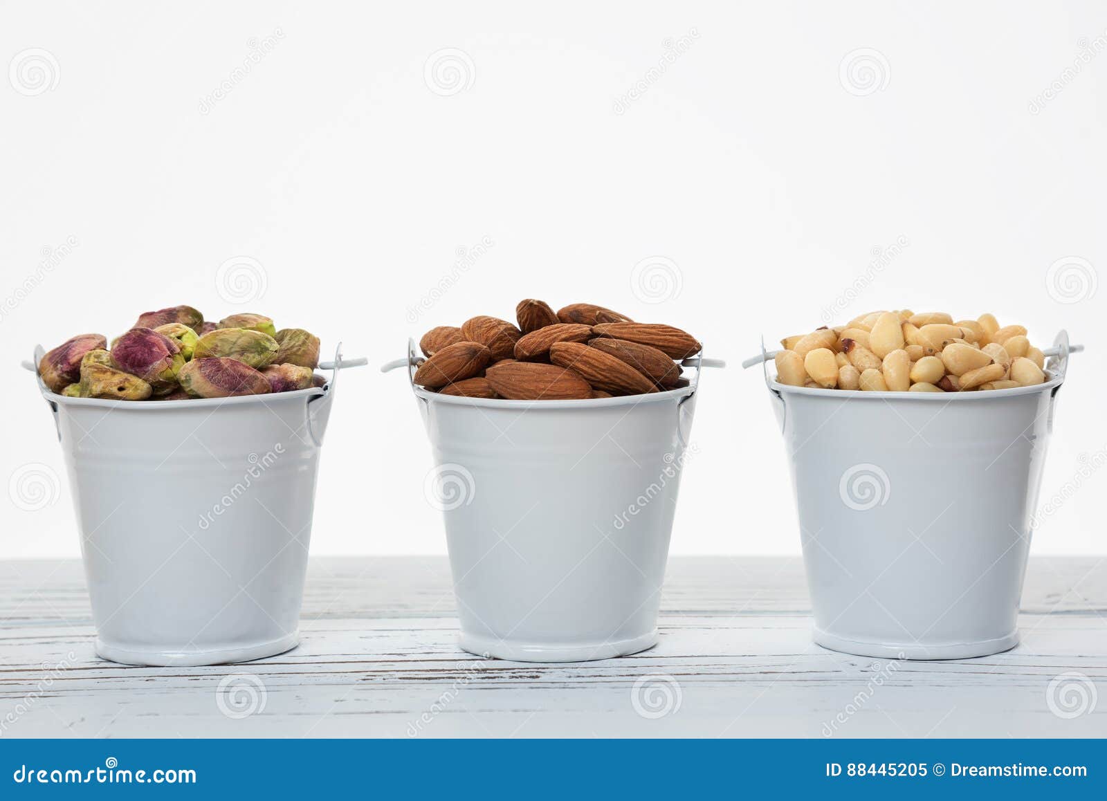 Buckets of Nuts on the Wooden Table with White Background Stock Image ...