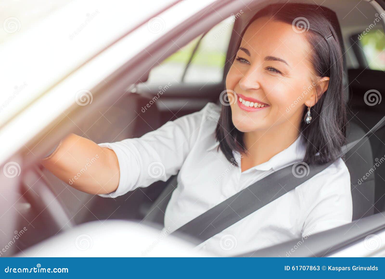Buckled up woman driving stock image. Image of panel - 61707863