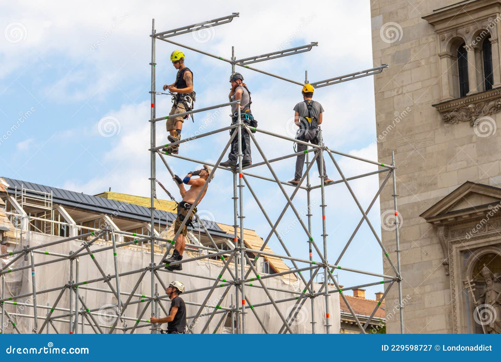 BUDAPEST, HUNGARY - AUGUST 19, 2021: Team of Construction Workers on a ...