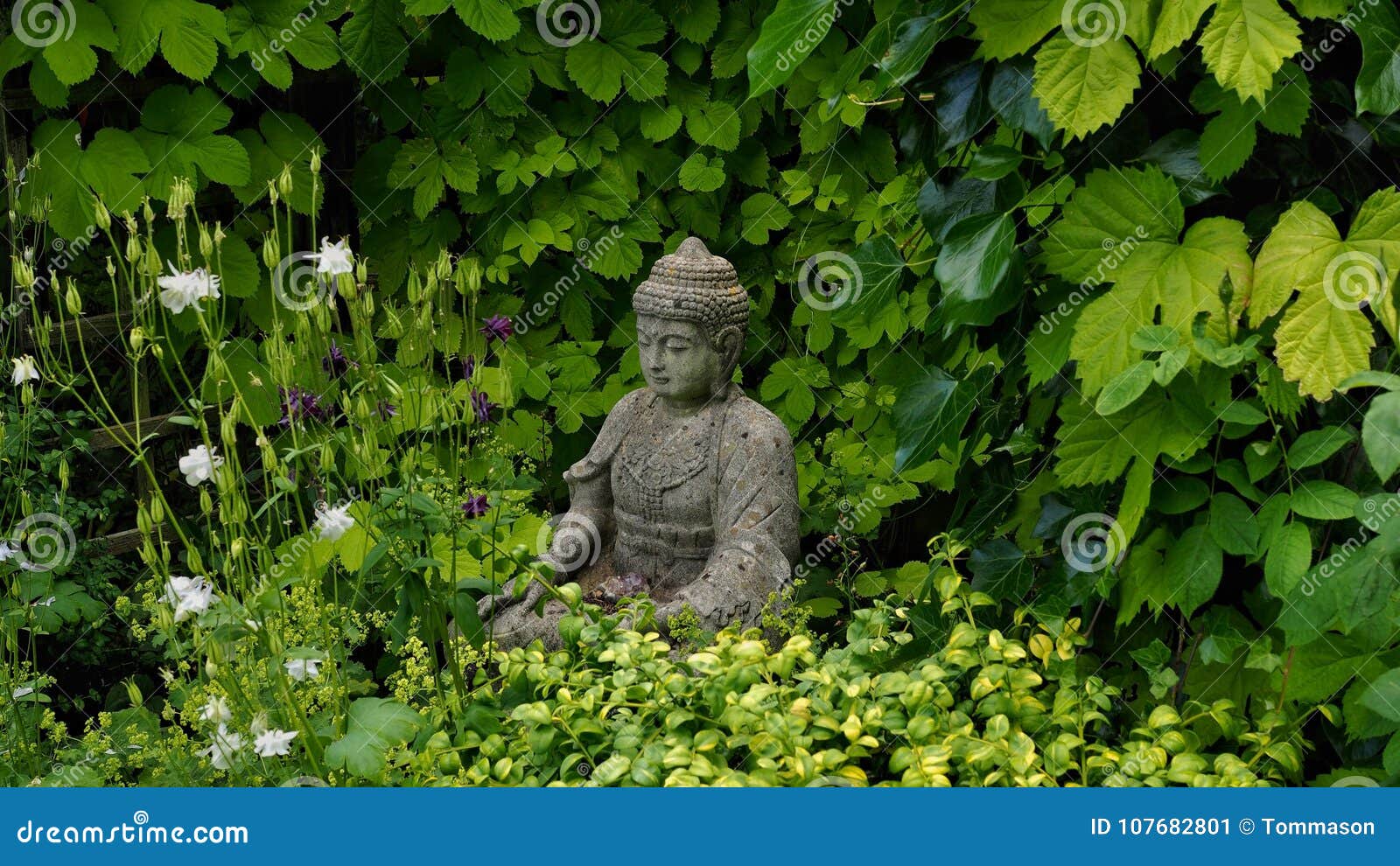 Buddha Figure in a Spring Garden Stock Image - Image of spring, statue ...