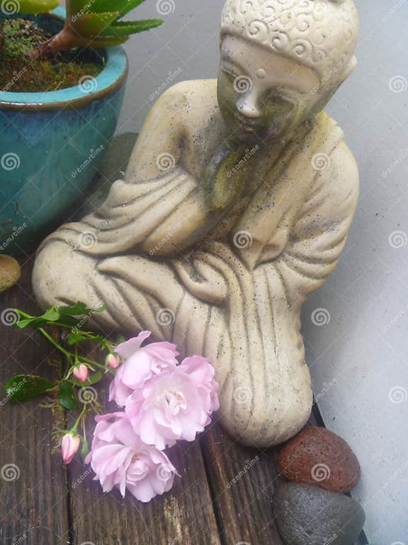 Buddha statue with rose stock image. Image of wood, rose - 64207089