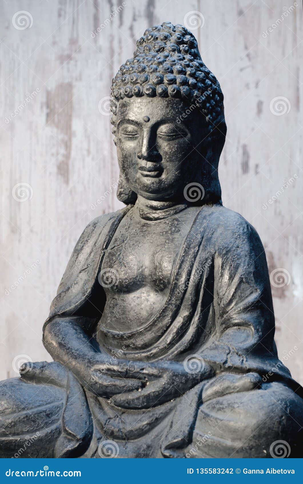 Buddha Statue Sitting in Meditation Pose Against Blurred Background ...