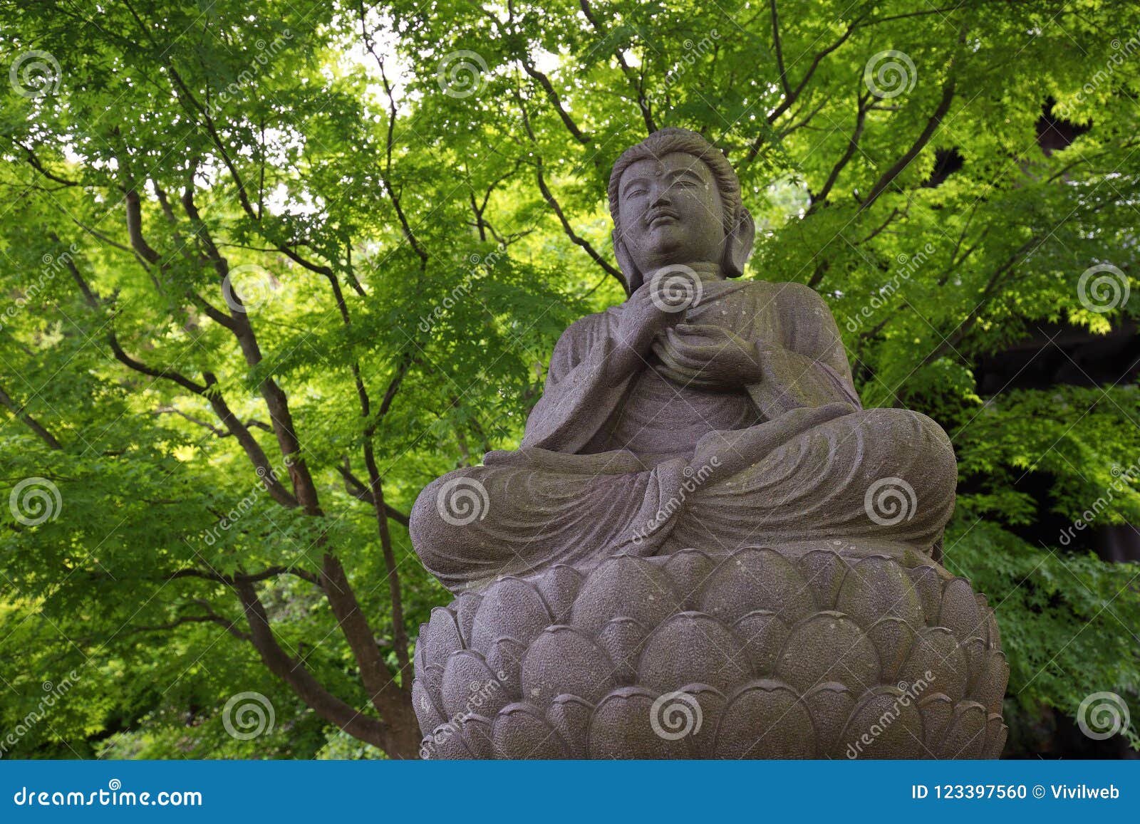 A Buddha Stone Statue With Flying Bird Royalty-Free Stock Photo ...