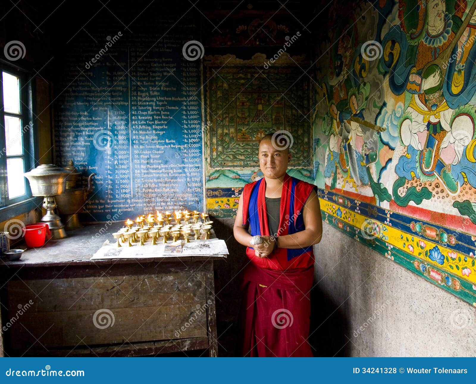 Buddhist Monk Lighting Candles in a Monastery Editorial Stock Photo ...