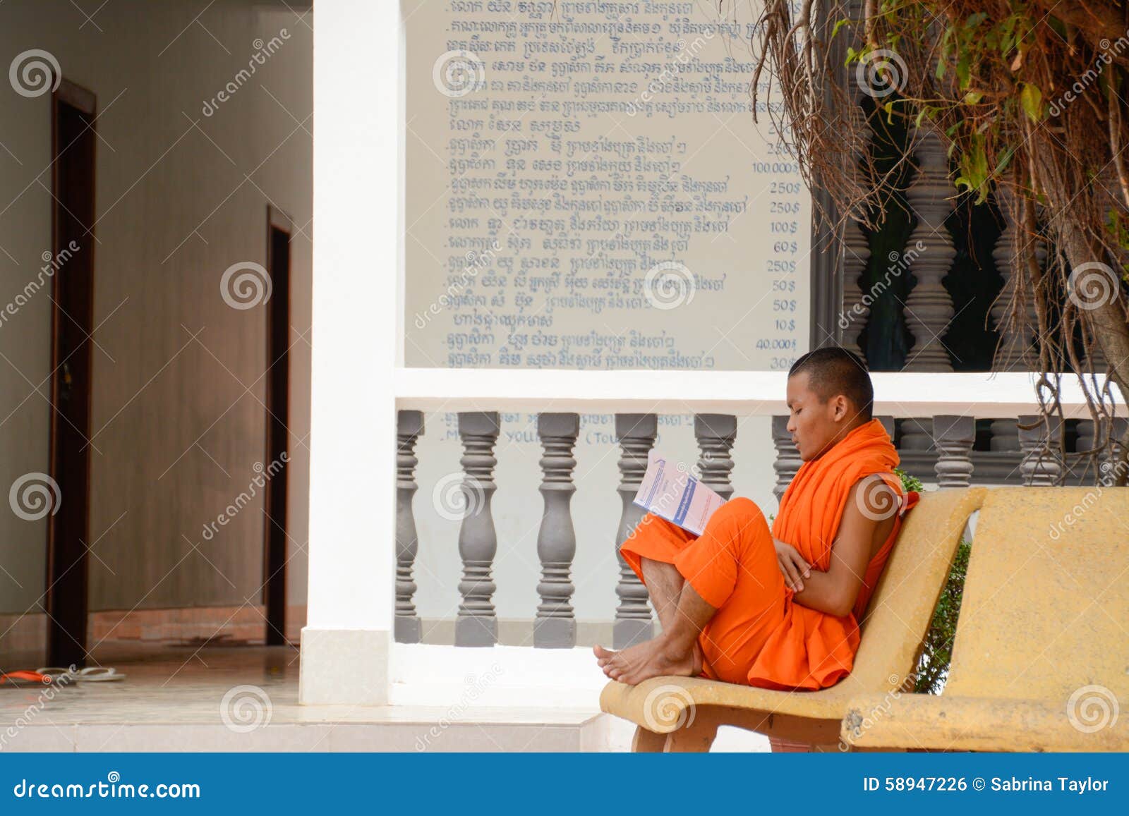 Buddhist Monk Reading Outside a Temple Editorial Photo - Image of ...