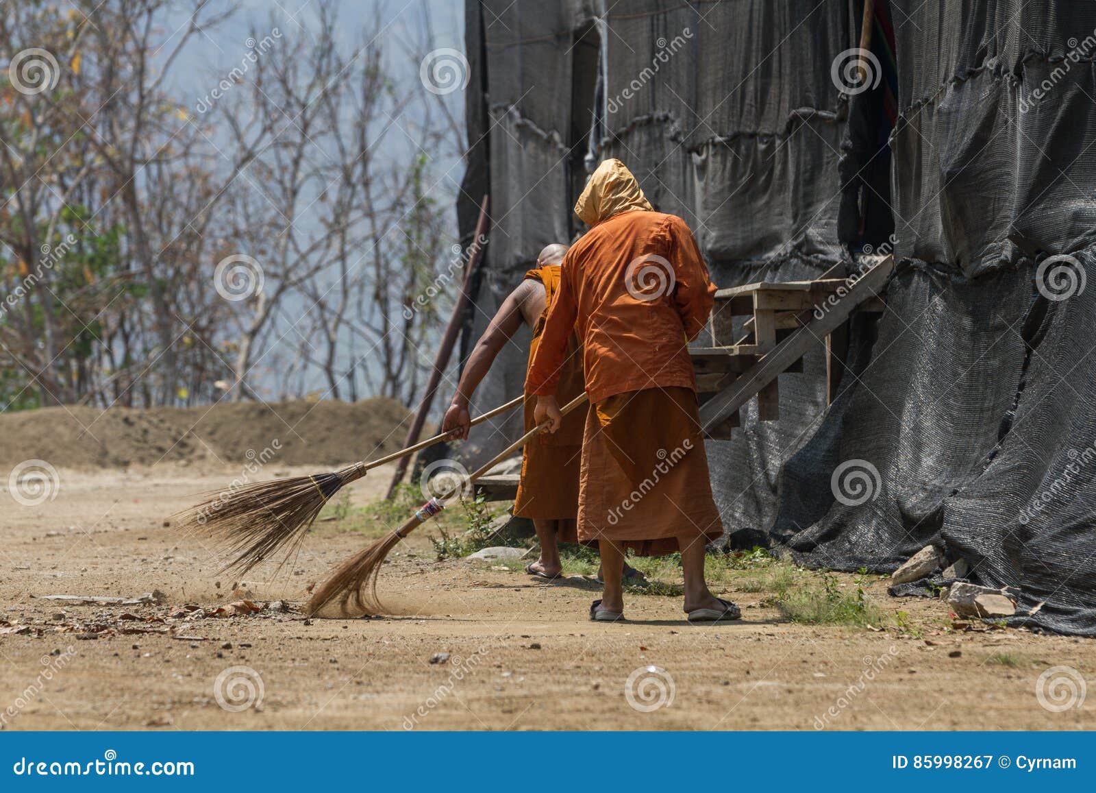Buddhist Monks Sweeping Courtyard in Temple in Thailand Editorial ...
