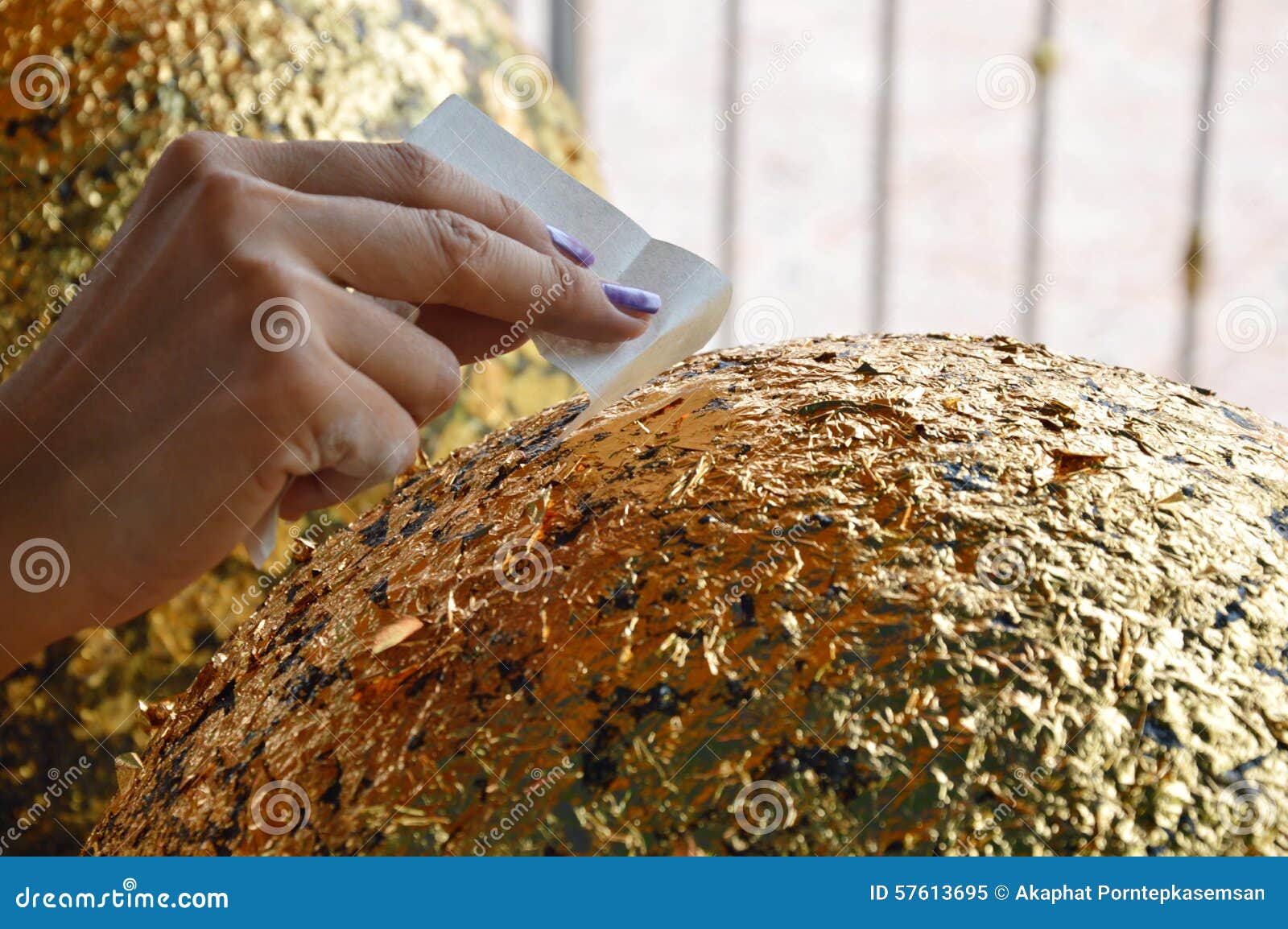 Buddhist Puts Gold Leaf on Round Stone Stock Image - Image of sacred ...