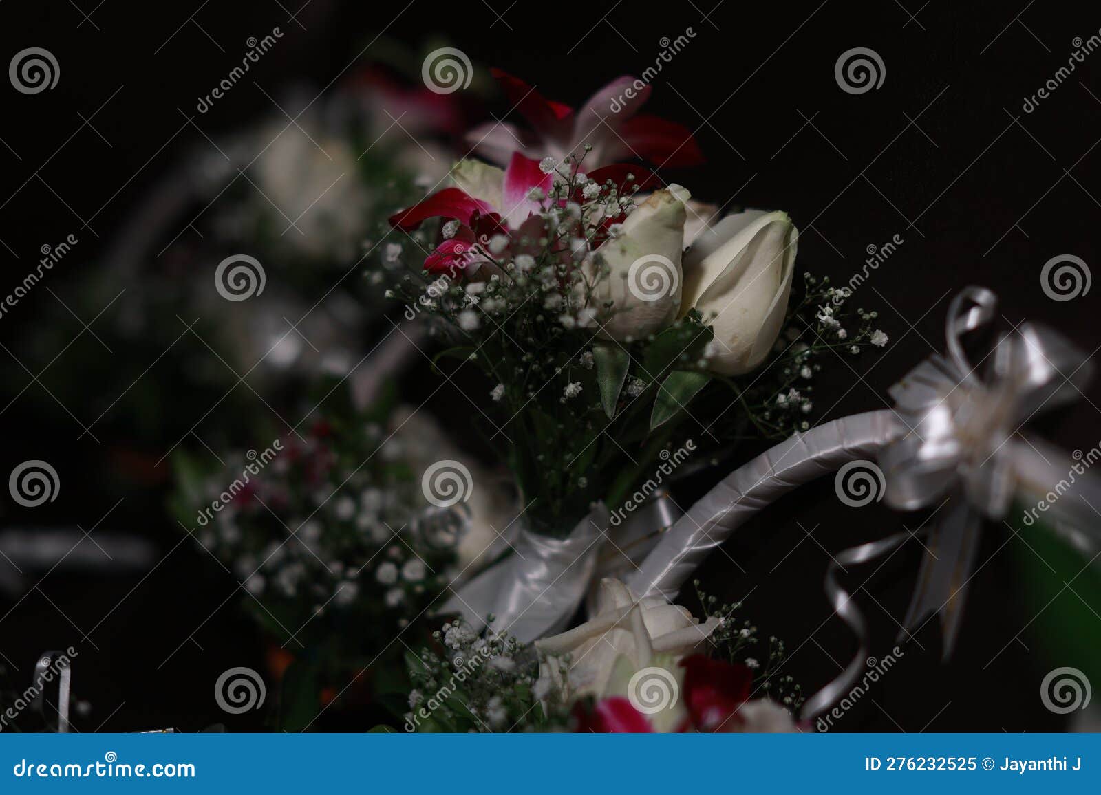 Budding White Roses Highlighted on a Bouquet of Flowers Stock Image ...