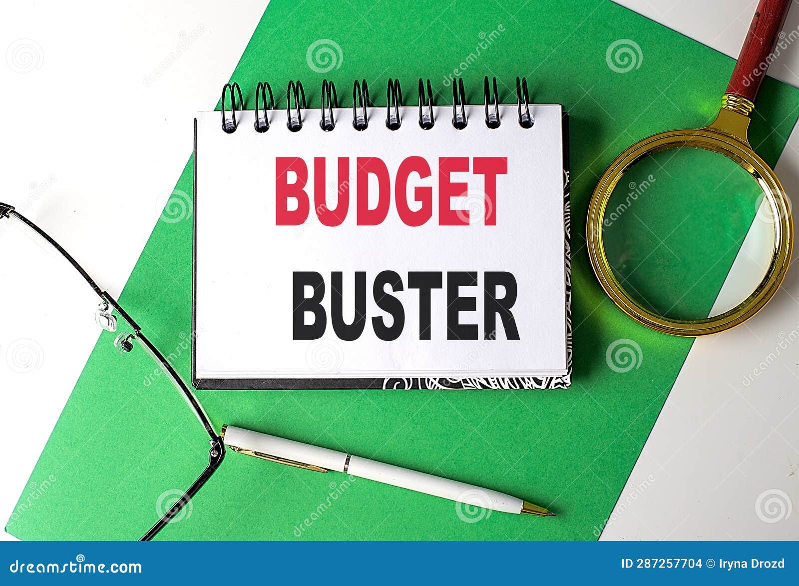 BUDGET BUSTER Text on Notebook on Green Paper Stock Photo - Image of ...