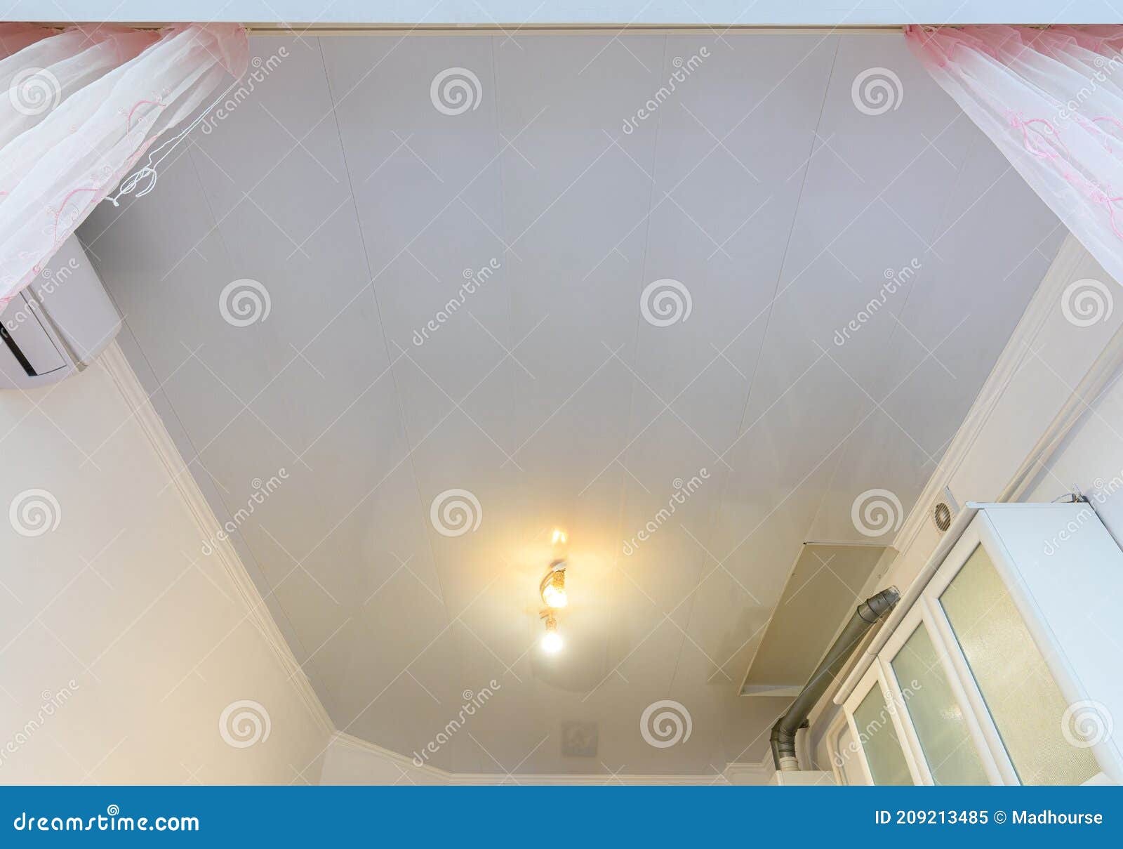 A Budget Ceiling Made of White Plastic Panels in a Spacious Kitchen ...