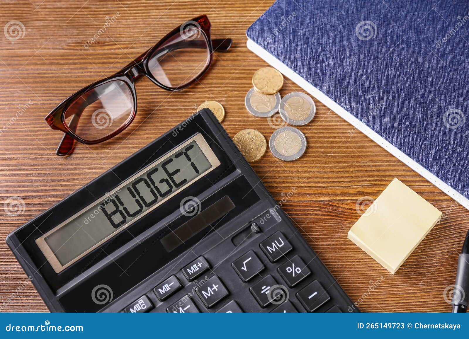 Budget Plan. Calculator, Glasses, Coins and Notebook on Wooden Table ...