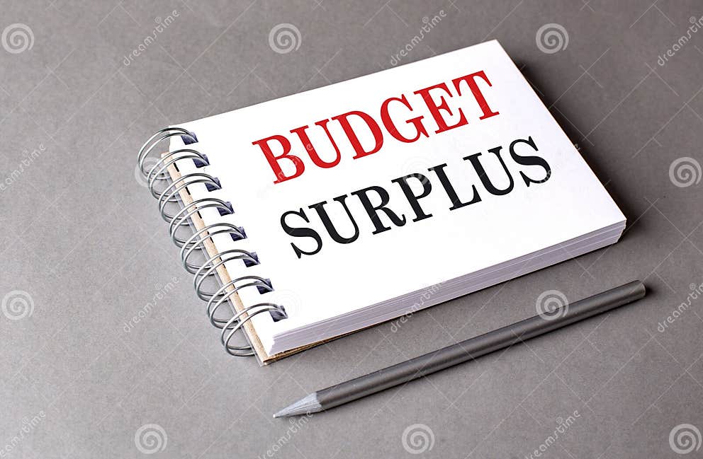 BUDGET SURPLUS Text on Notebook on Grey Background Stock Image - Image ...