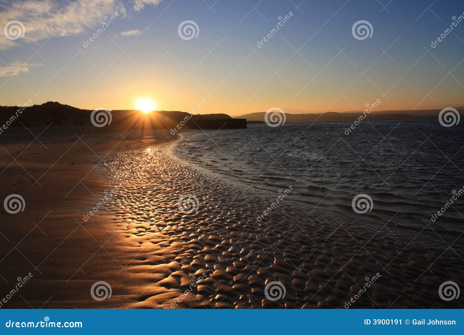 Budle Bay sunset stock image. Image of footprints, sand - 3900191