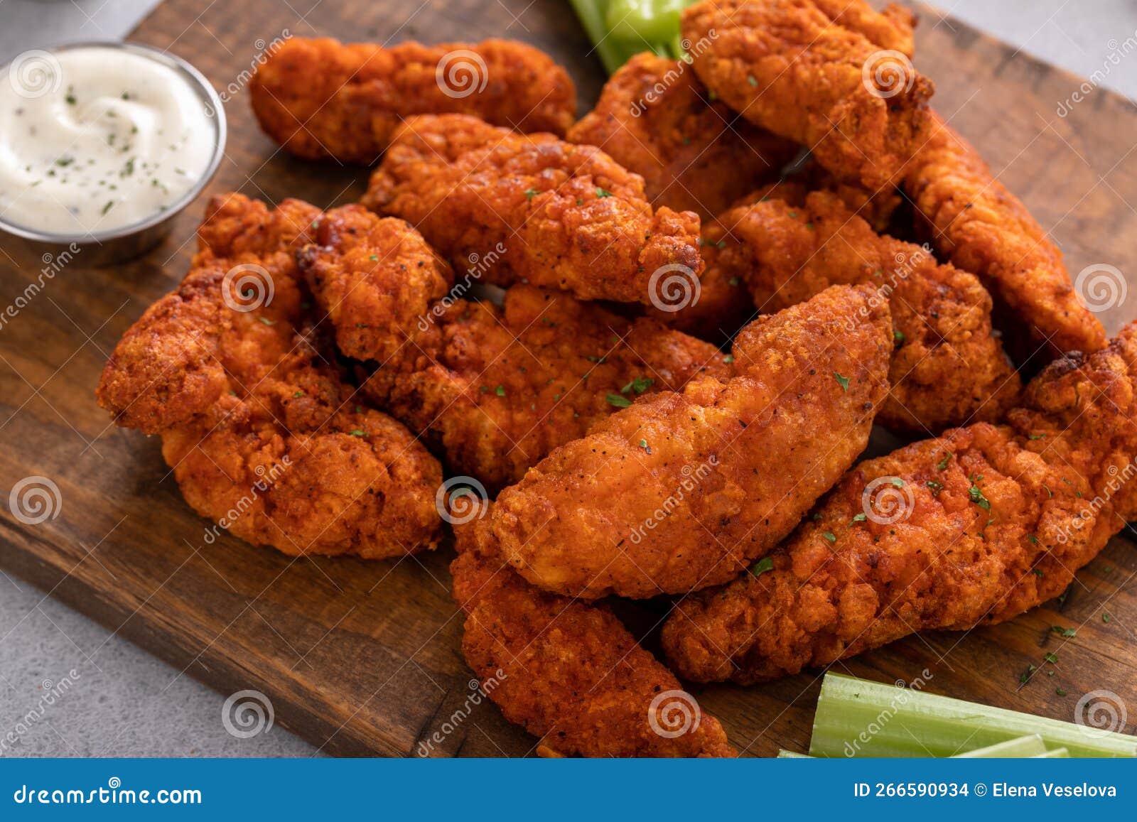 Buffalo Chicken Fingers Served with Celery and Ranch Stock Photo ...