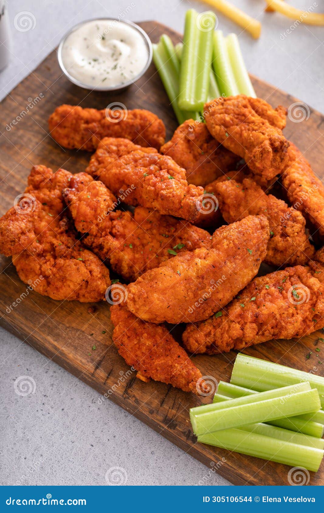 Buffalo Chicken Strips on a Board with Ranch and Celery Stock Photo ...