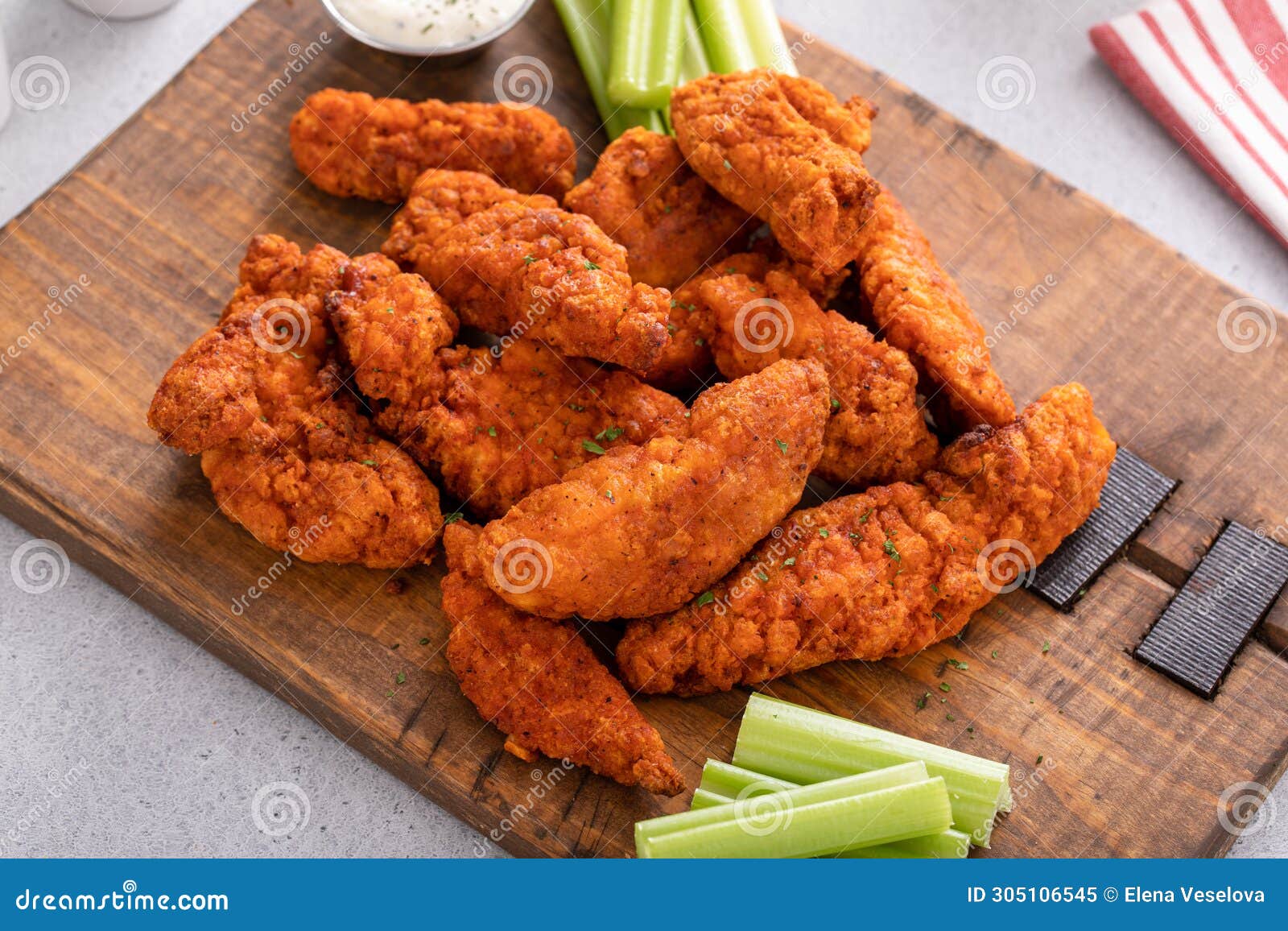 Buffalo Chicken Strips on a Board with Ranch and Celery Stock Image ...