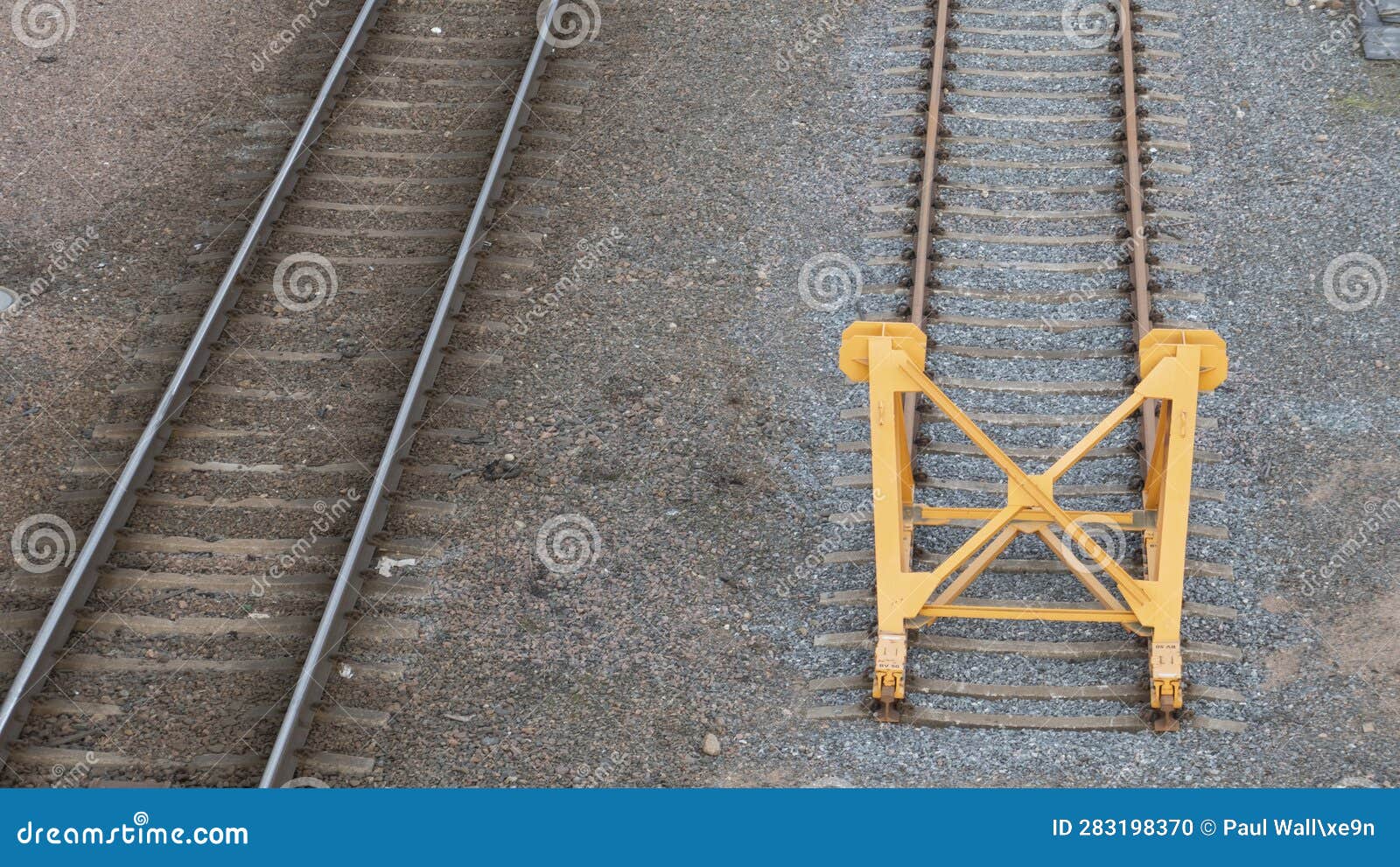 A Buffer Stop at the End of the Train Track. Stock Photo - Image of ...