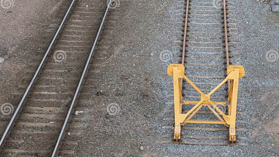 A Buffer Stop at the End of the Train Track. Stock Photo - Image of ...