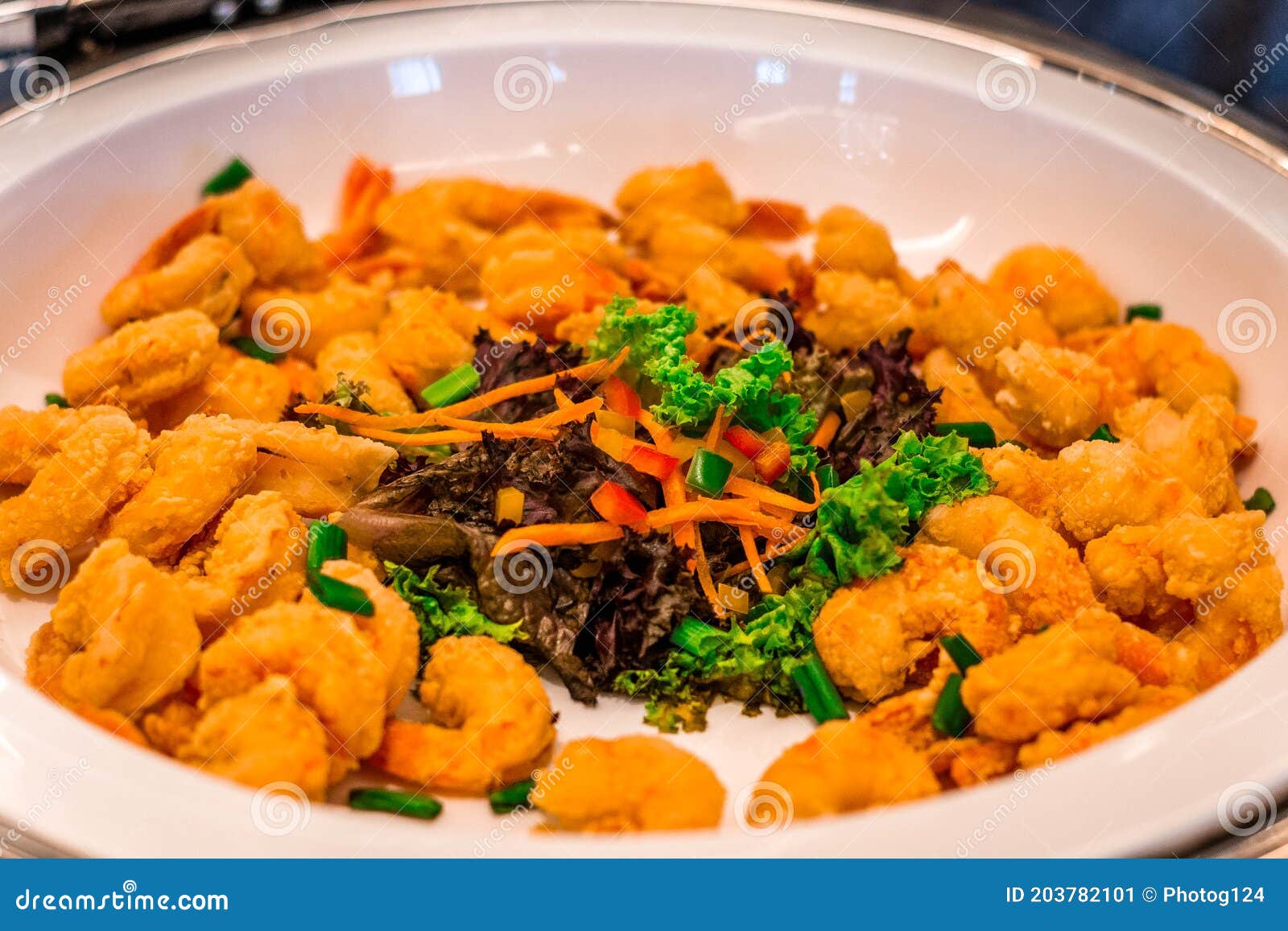 A Buffet Offering of Deep Fried Breaded Shrimp Served in a White ...