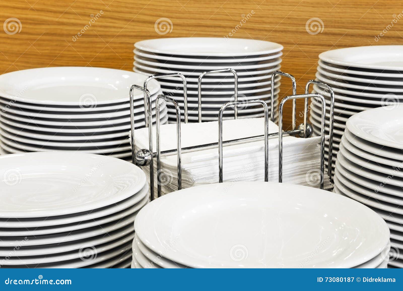 Buffet Platters Stacked Around Napkin Display Stock Image - Image of ...
