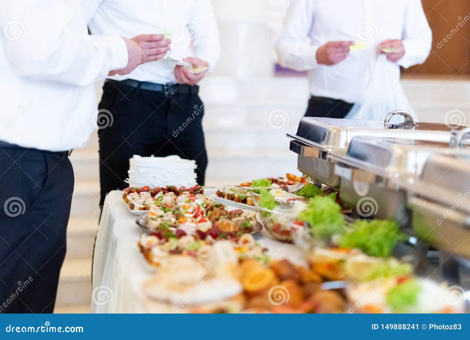 Buffet Table with Food and Waiters Checking If Everything is Served ...