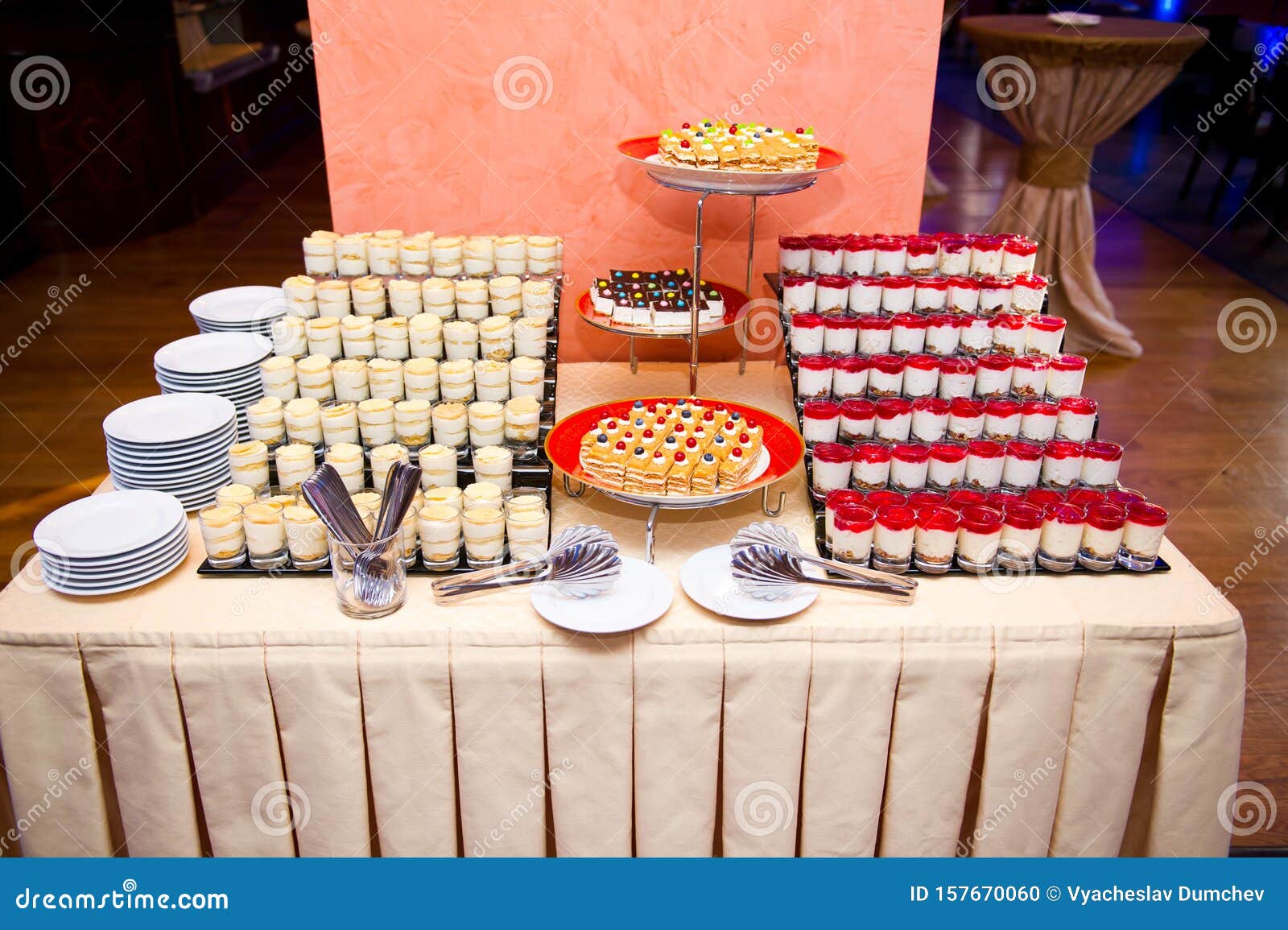 Buffet Table with Various Snacks, Plates and Cutlery Stock Photo ...