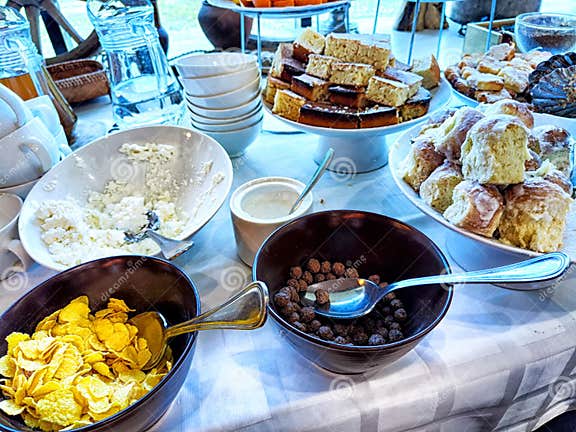 Buffet with Various Breakfast Items Displayed at a Cozy Gathering in a ...