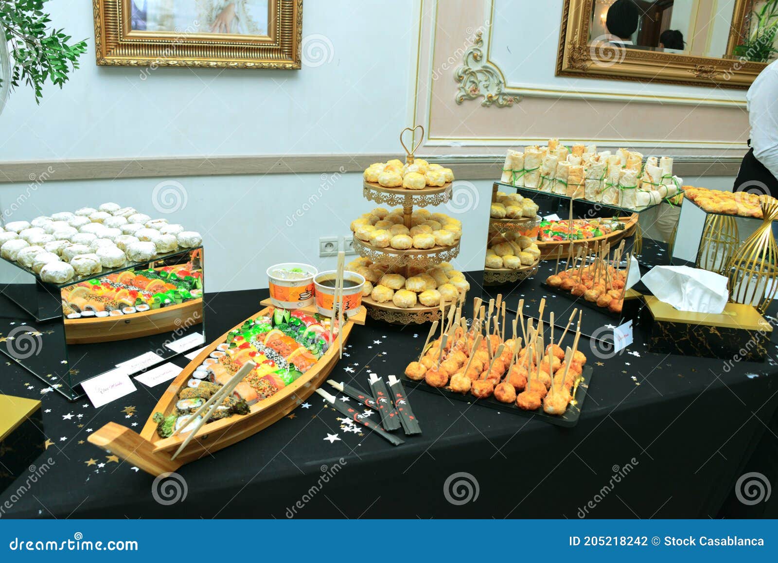 A Buffet of Various Salted Macarons, Sushi and Oriental Sweets Stock ...