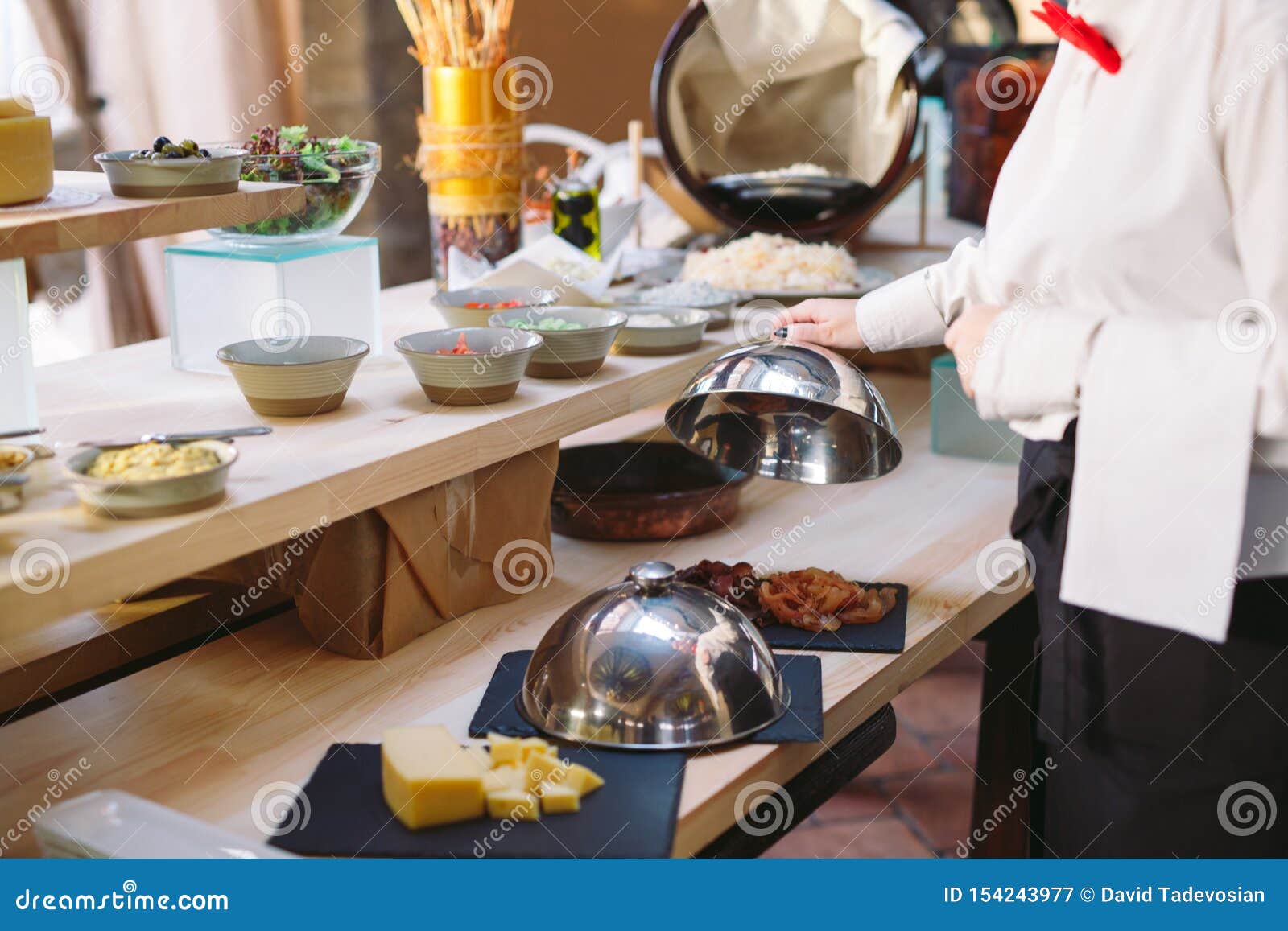 Buffet. the Waiter Sets the Table. Fruits, Salads. Stock Image - Image ...