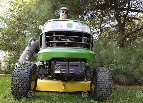Bug S-Eye View of Man on Riding Lawnmower Stock Photo - Image of aged ...