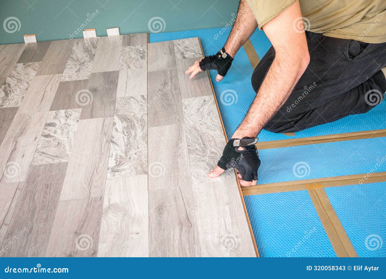 Laying Laminate Flooring With Your Own Hands. The Master Lays The ...