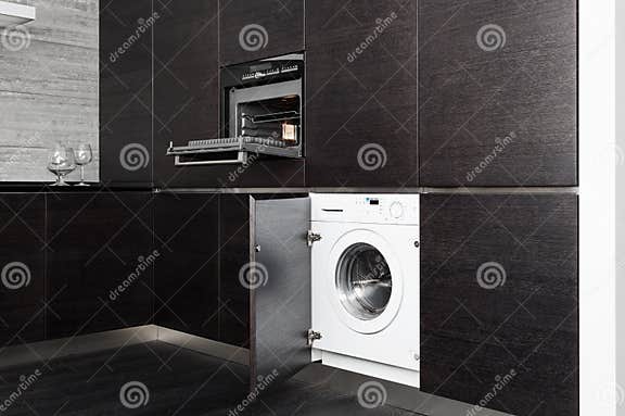 Build-in Washing Machine and Cooker on Kitchen Stock Image - Image of ...