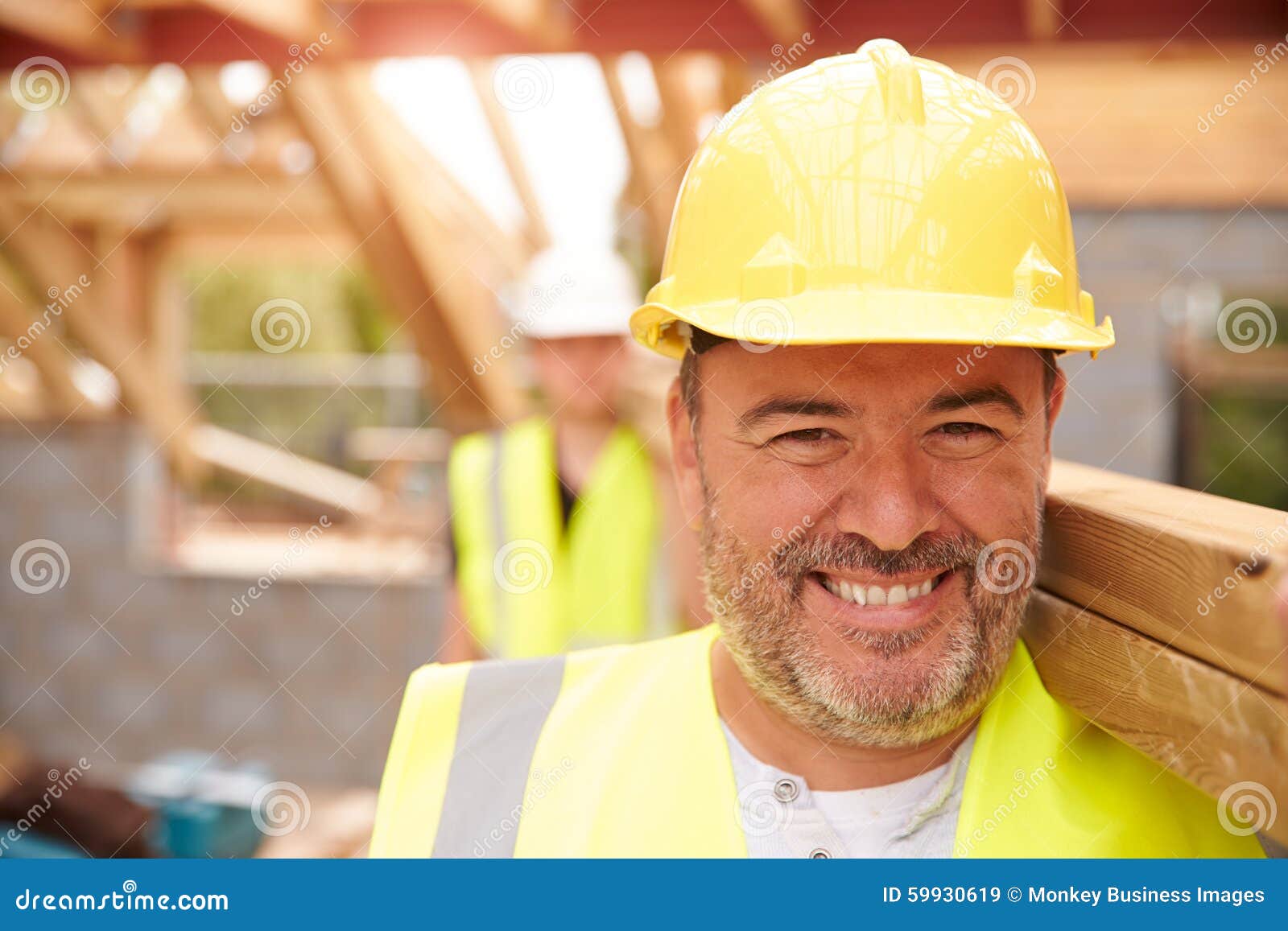 Builder and Apprentice Carrying Wood on Construction Site Stock Image ...