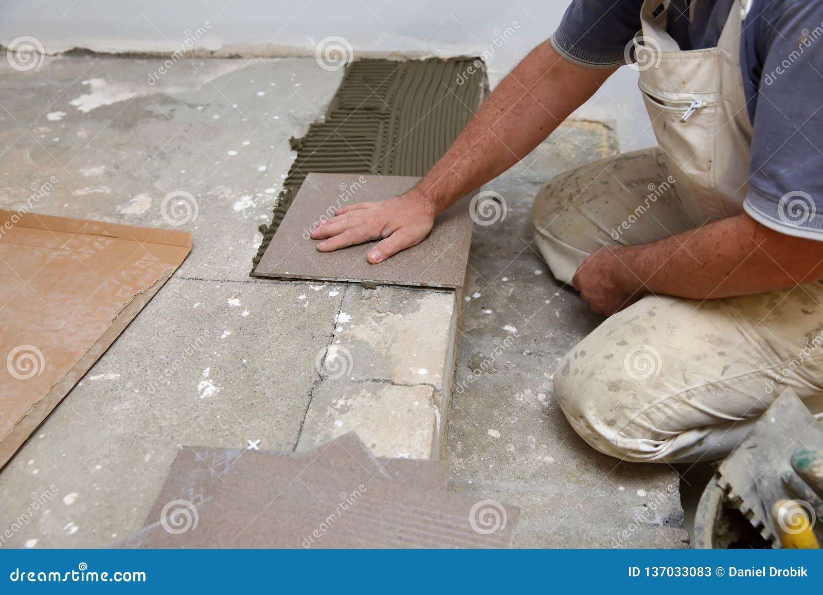 The Builder Arranges Ceramic Tiles on the Stairs Inside the Building ...