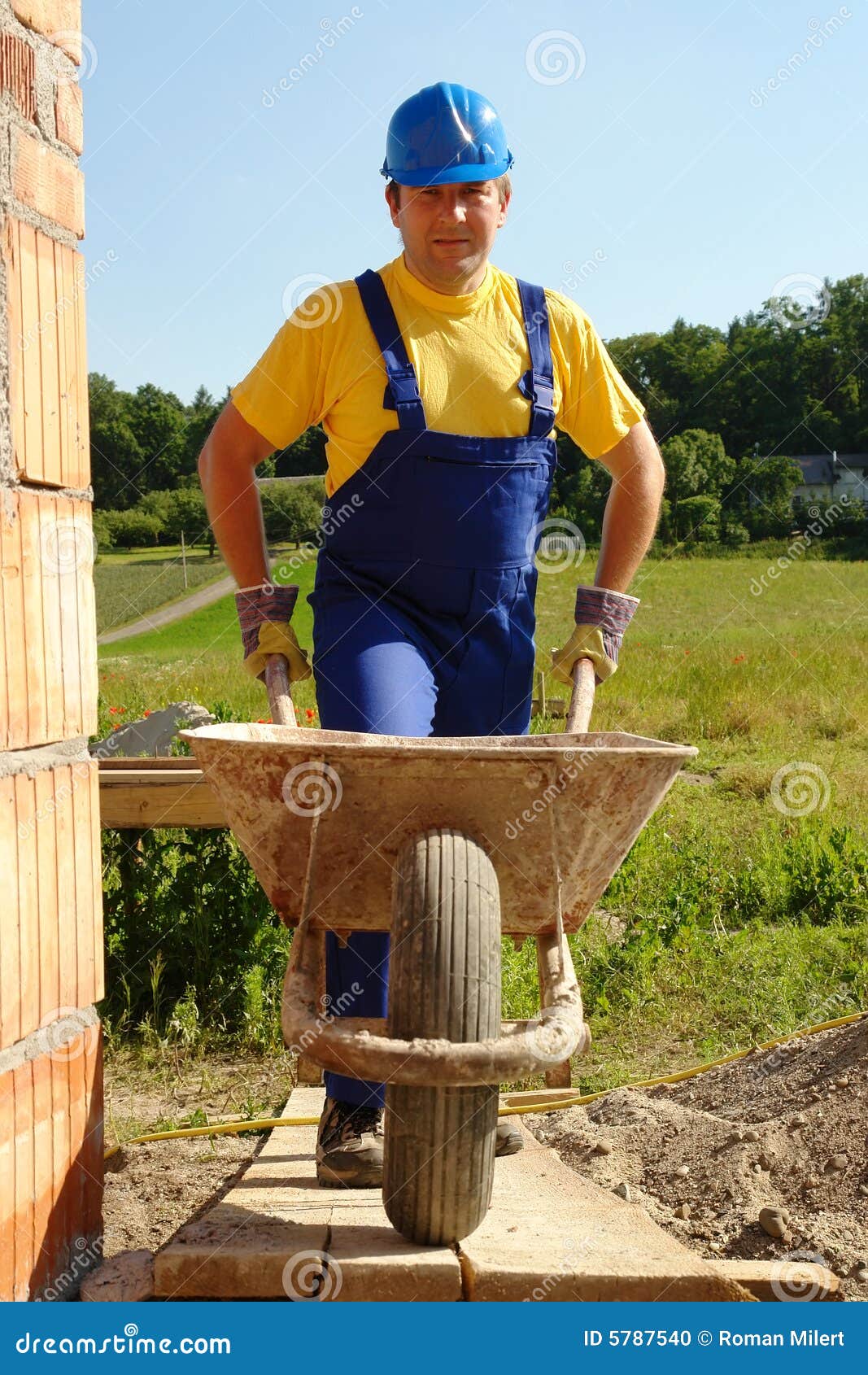 Builder with barrow stock photo. Image of helmet, staff - 5787540