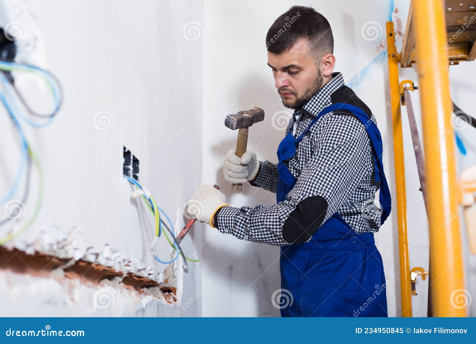 Builder is Beating a Part of the Wall with a Hammer Stock Image - Image ...