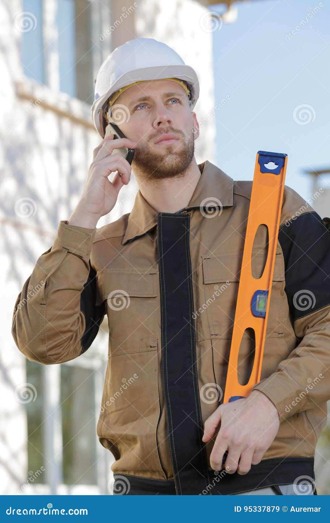 Builder at Building Site Talking on Mobile Phone Stock Image - Image of ...