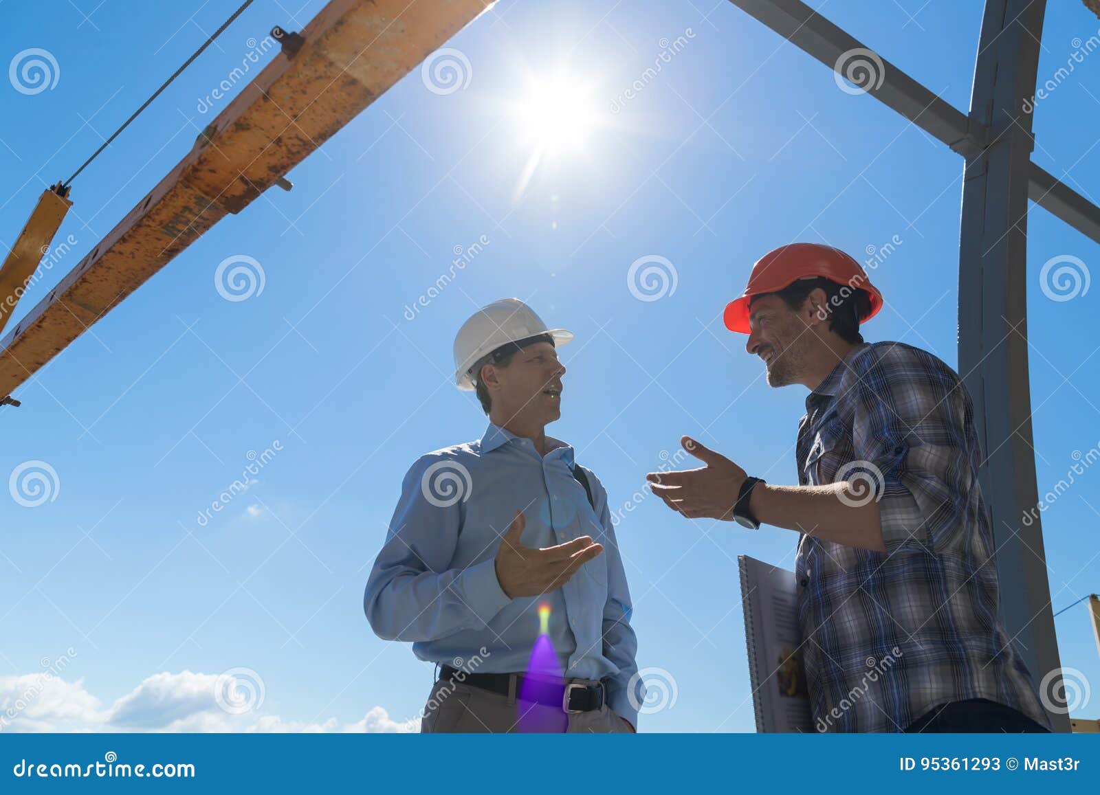 Builder and Business Man Discussing Project Meeting Outdoors on Buiding ...