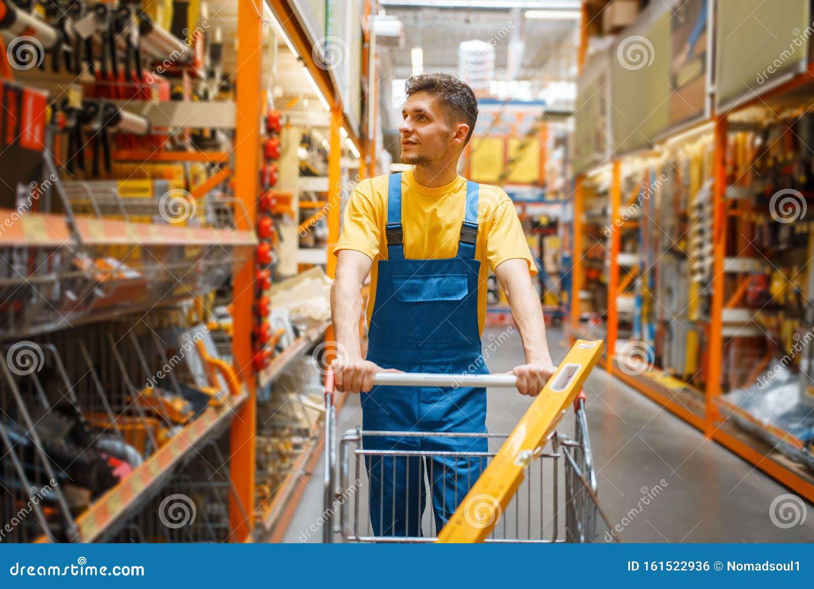 Builder with Cart at the Shelf in Hardware Store Stock Photo - Image of ...