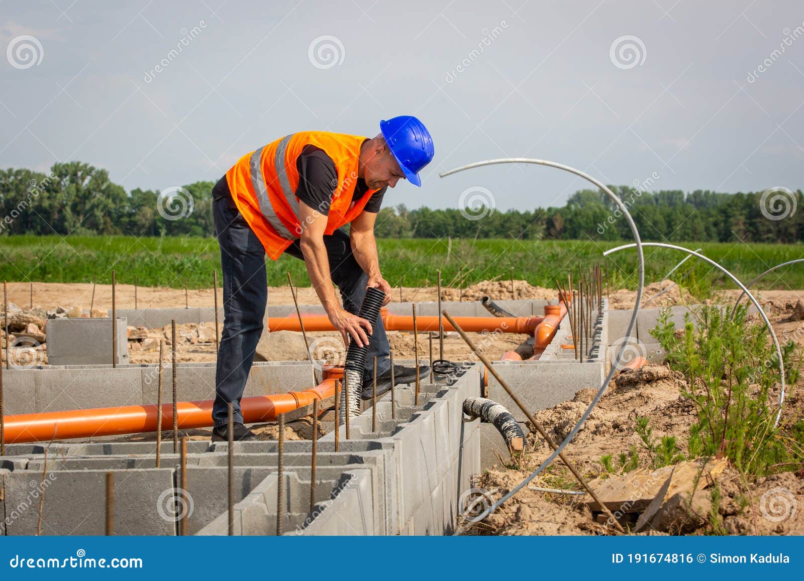 Builder Checking House Plan For Steel Fixing Stock Photography ...