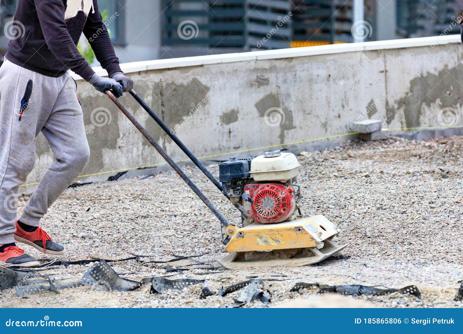 The Builder Compacts Crushed Stone with a Gasoline Vibratory Compactor ...