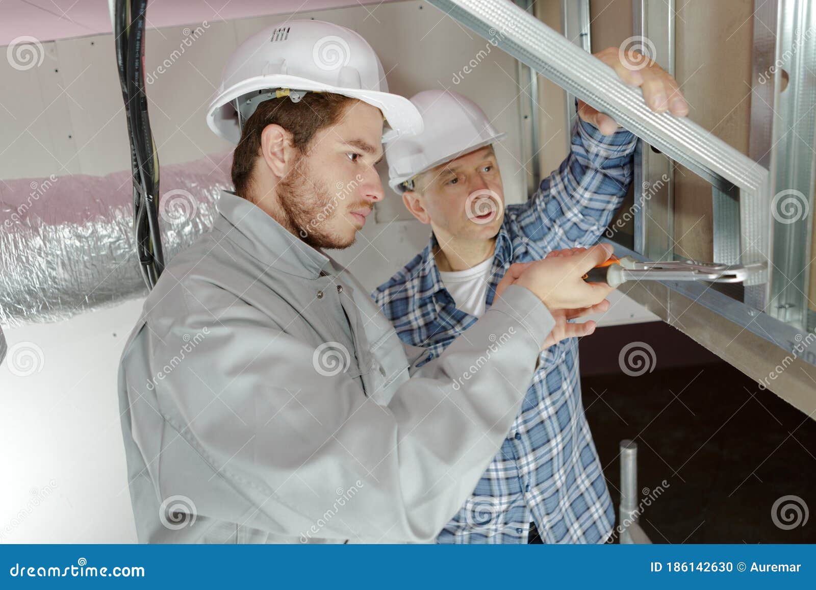 Builder on Construction Site Stock Photo - Image of orange, effort ...