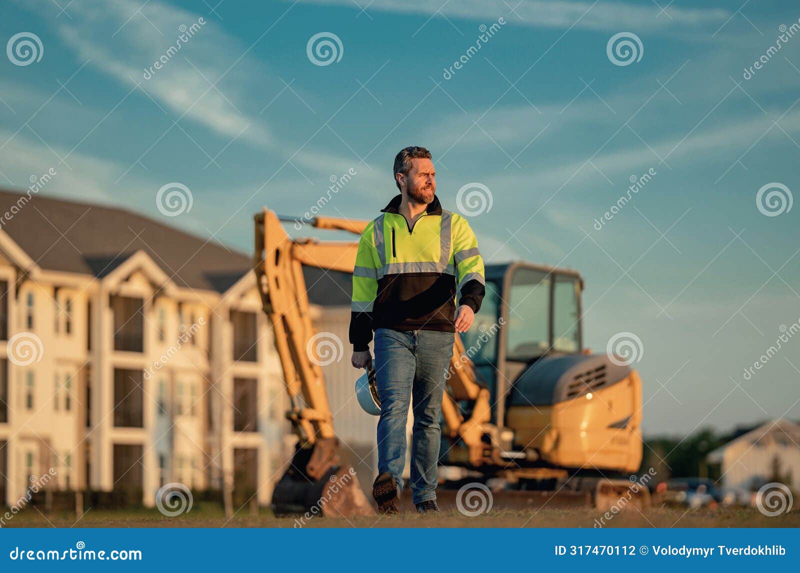 Builder in a Construction Site. Builder with Excavator Ready To Build ...