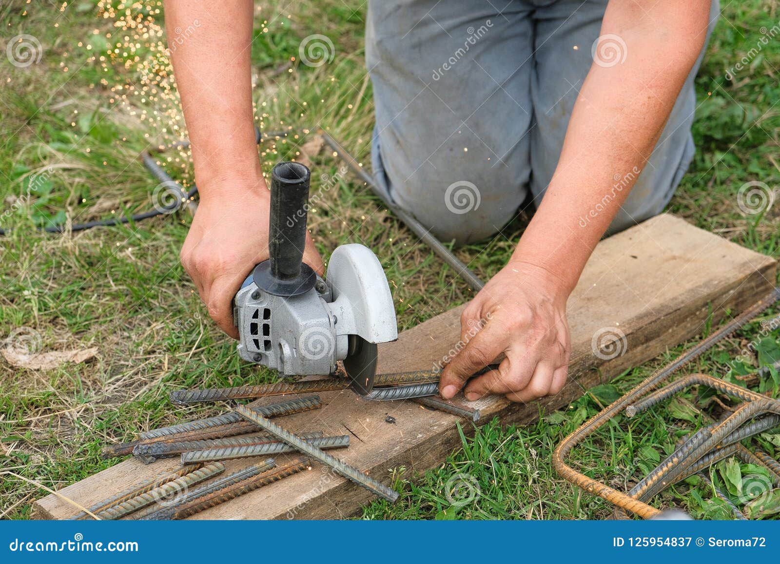 Builder on the Construction Site Cutting Metal Grinder Stock Image ...