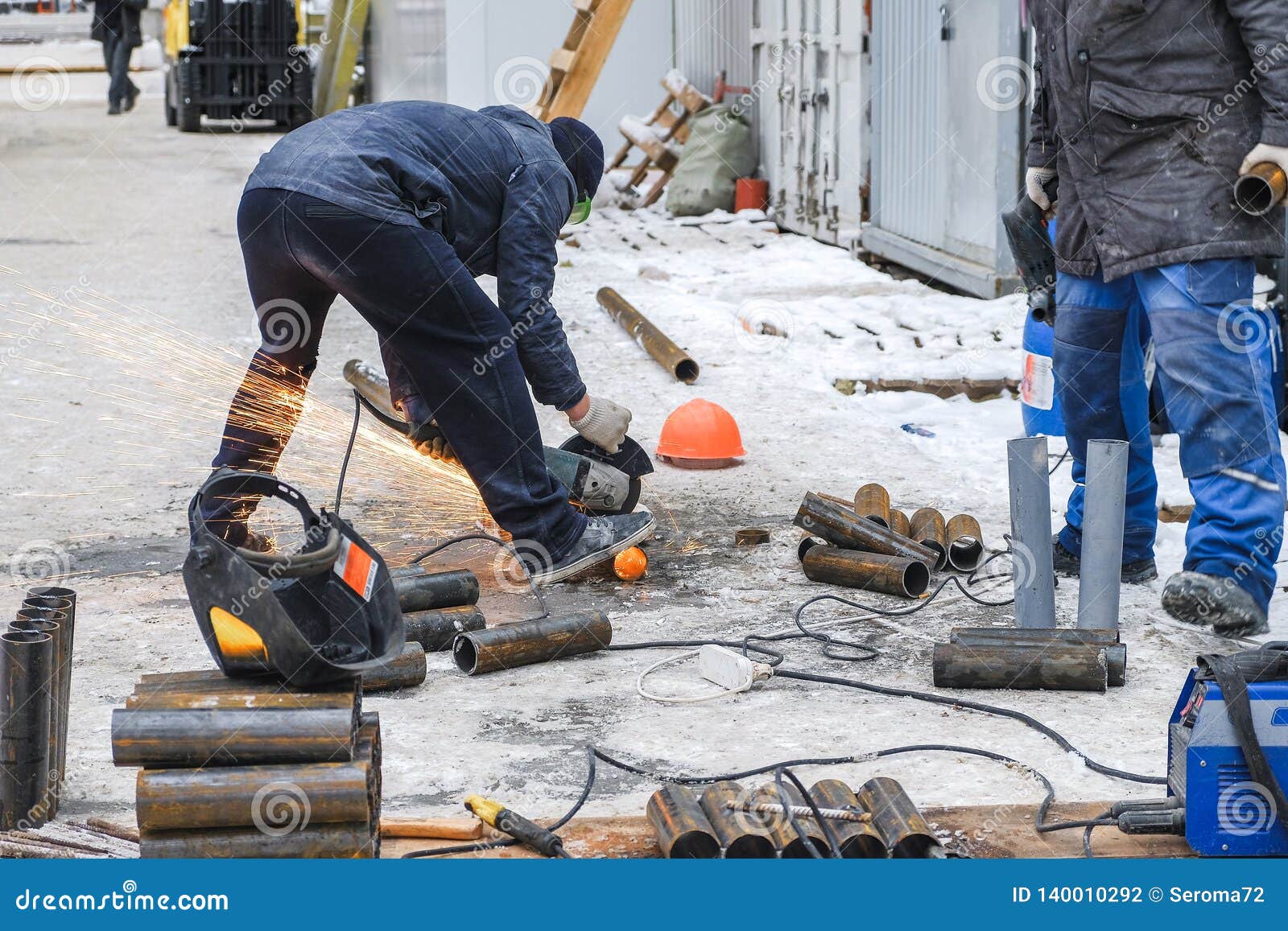 Builder on the Construction Site Cutting Metal Grinder Editorial ...