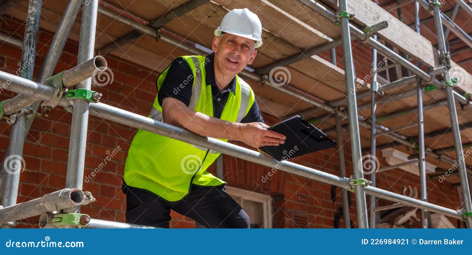 Builder Construction Worker Contractor on Building Site with Clipboard ...