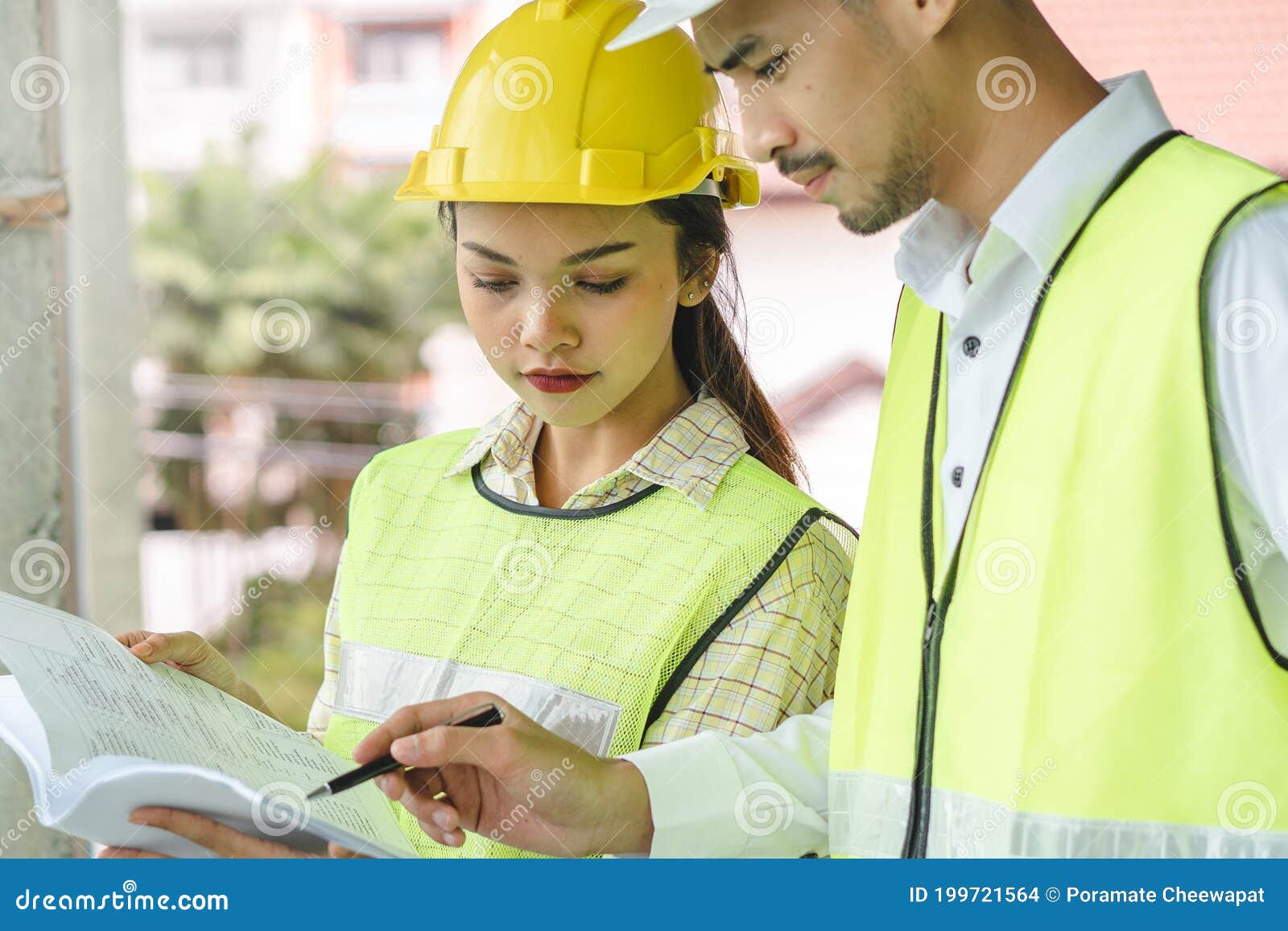 Builder Consultancy. Two Engineer Consulting and Checking Material and ...